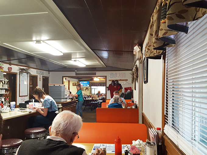 Where orange booths meet friendly service. The classic diner color scheme isn't a design choice – it's a tradition that says "comfort food served here."
