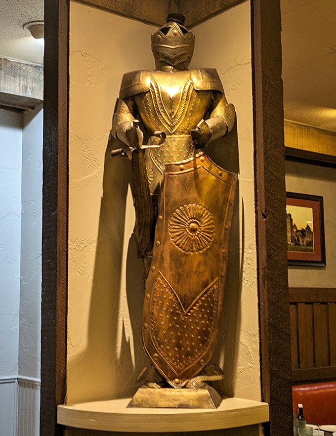 A knight stands guard in the dining room—perhaps protecting diners from the temptation to order just one more slice of that coconut cream pie.