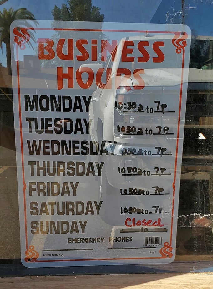 Business hours posted with no-nonsense clarity – closed Sundays because even fry bread perfectionists need a day of rest.