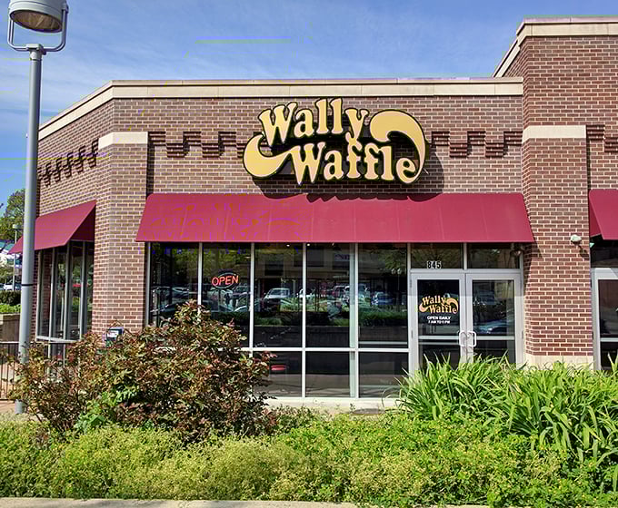 The storefront stands proudly among landscaping, like a breakfast superhero ready to rescue you from your morning hunger.