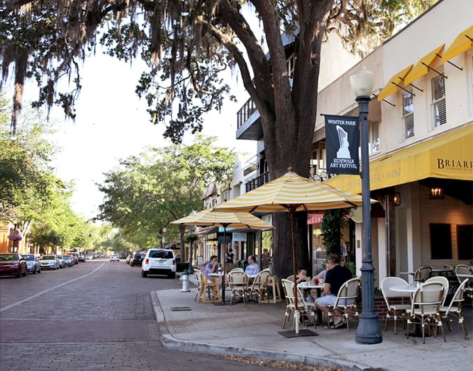 Sidewalk dining under ancient oaks creates the perfect setting for people-watching—Winter Park's unofficial Olympic sport.