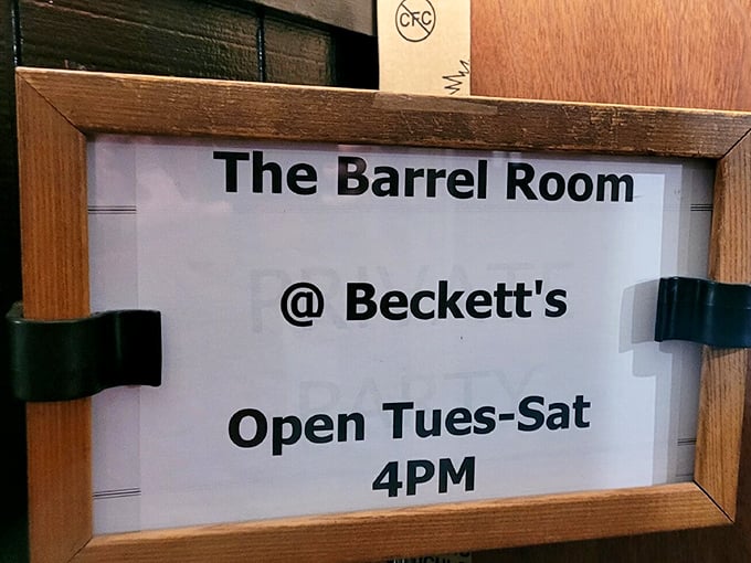 The Barrel Room's hours posted like an invitation to happiness. Tuesday through Saturday, 4PM—when the magic begins.