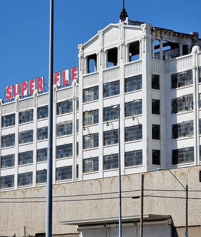 Super Flea's impressive white facade stands tall against the blue Kansas City sky, a cathedral of commerce for the bargain-hunting faithful.