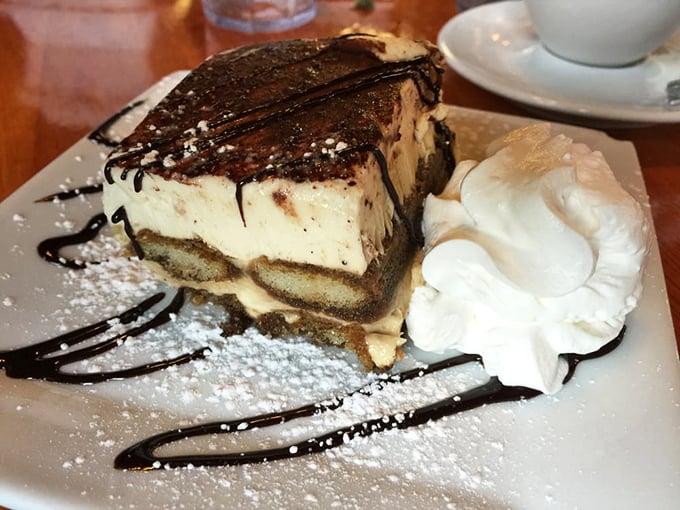 Tiramisu that would make your Italian grandmother weep with joy—or jealousy. That chocolate drizzle is performing culinary poetry.