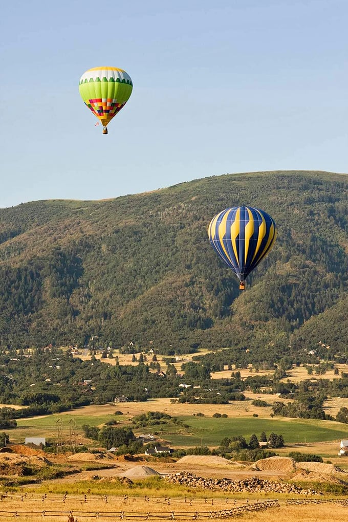Hot air balloons drift over Little Lake Valley, offering the kind of peaceful panorama that makes smartphone scrolling seem suddenly ridiculous.