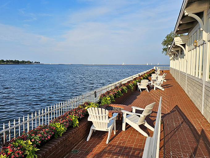 Lake Michigan stretches to the horizon as white Adirondack chairs stand at attention, ready for you to command views with your cocktail.