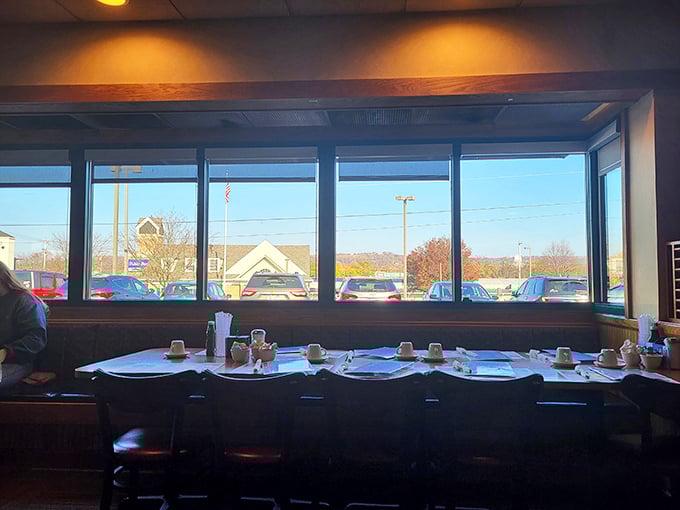 Window seats offer both people-watching and natural light—the perfect backdrop for morning coffee contemplation or catching up with friends.