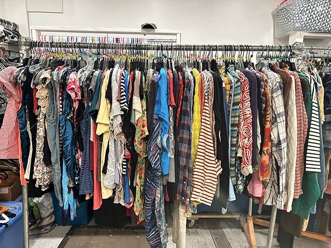 Women's clothing racks burst with color and pattern—each hanger a potential fashion revelation at prices that feel almost illegal.