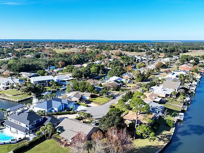 An aerial view that explains everything—water on all sides, boats in backyards, and sunshine everywhere. This isn't just a location; it's a lifestyle.