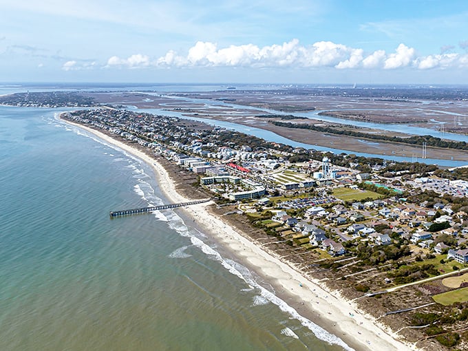 From above, the island reveals its perfect positioning—nestled between Atlantic waves and marshy waterways like nature's perfect compromise.