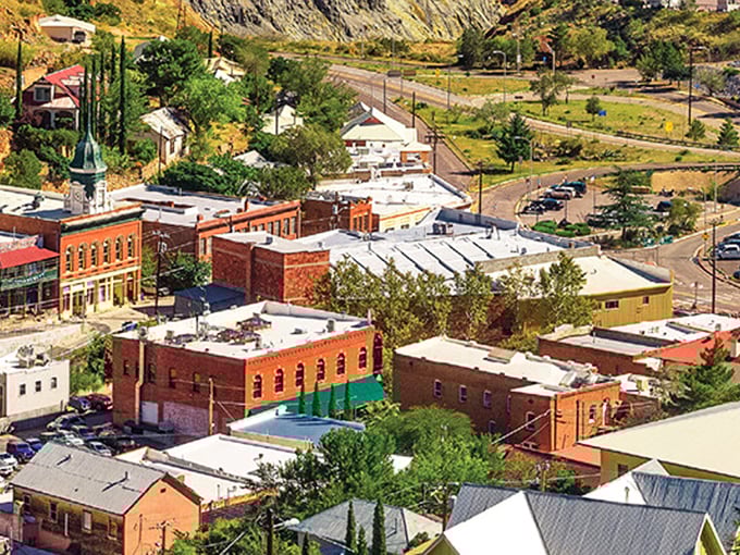 From above, Bisbee reveals its true nature – a town that seems to grow organically from the canyon walls. Red-brick buildings cluster like treasures in the desert.