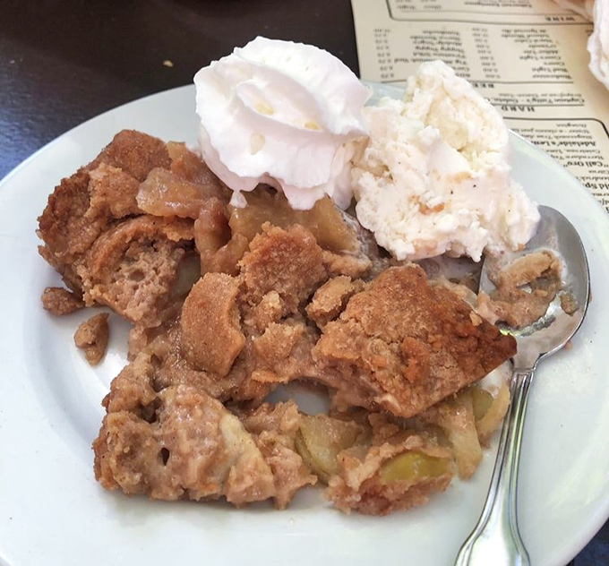 Sweet finale: This apple cobbler isn't just dessert—it's warm nostalgia topped with ice cream, the perfect ending to your mountain adventure.