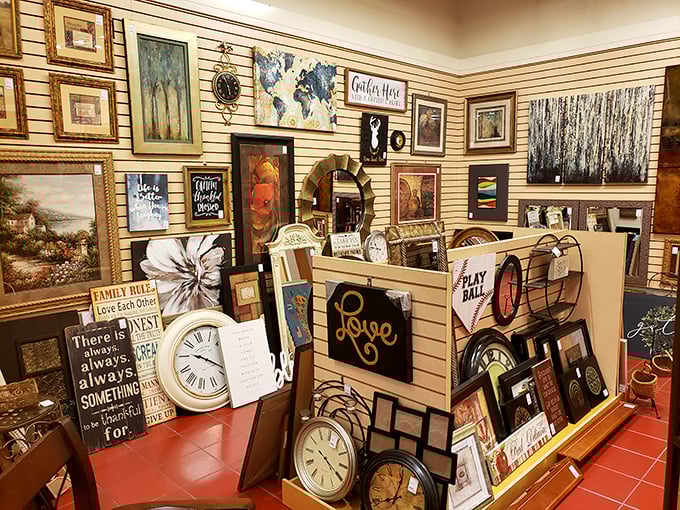 A wall of art and clocks that proves one person's "no longer matches my decor" is another's "perfect statement piece."