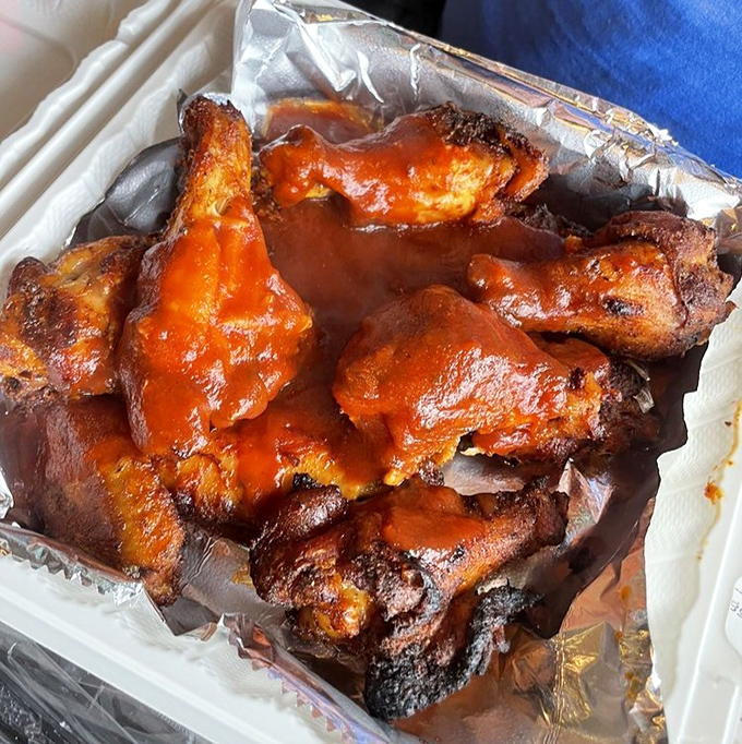 These wings aren't just tossed in sauce—they're lovingly baptized in it. The kind of finger food that ruins manicures and creates memories.