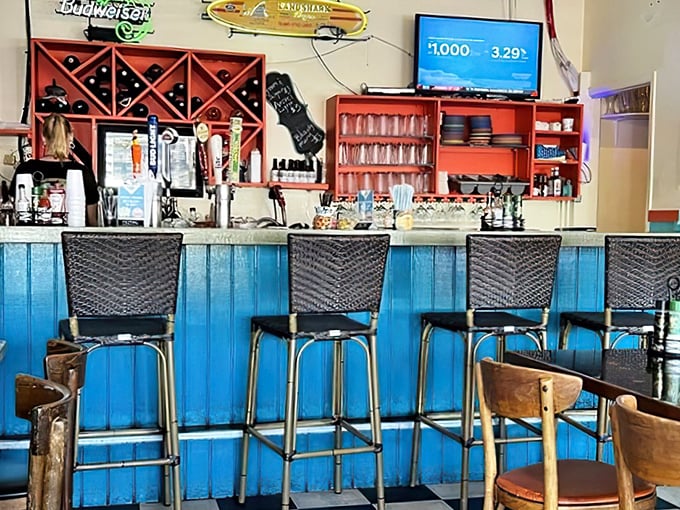 The bar area – where strangers become friends over cold drinks and fish tales. Those blue panels have heard some stories worth repeating. 