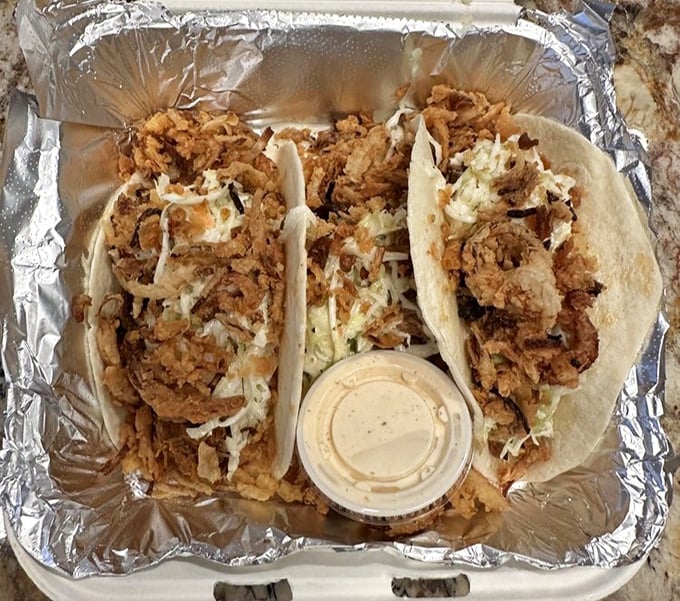 These tacos aren't messing around – stuffed with crispy protein and fresh toppings, they're the handheld happiness that makes takeout feel like a celebration.