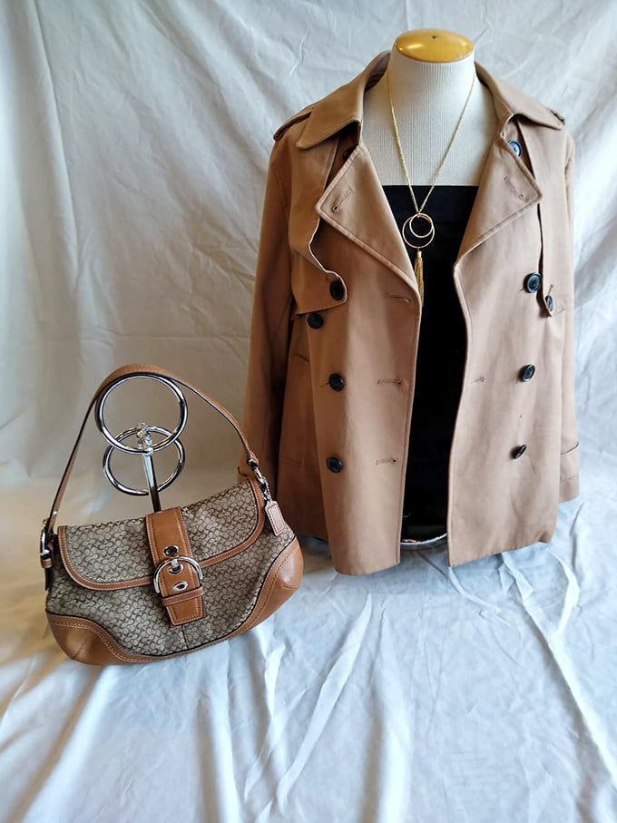 This trench coat and Coach bag combo isn't just fashion—it's a masterclass in thrift store strategy. Designer finds that would make your full-price friends jealous.
