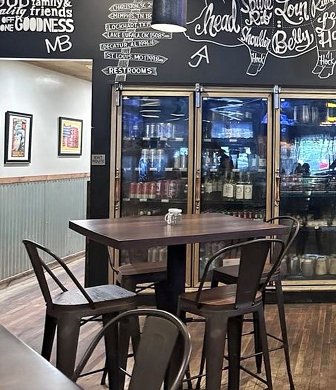 A chalkboard wall maps out barbecue's greatest hits while refrigerator doors promise cold refreshment – the barbecue equivalent of "you had me at hello."