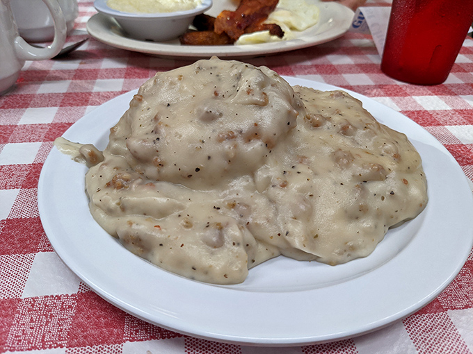 Biscuits drowning happily in gravy – the kind of meal that makes cardiologists nervous but souls happy.