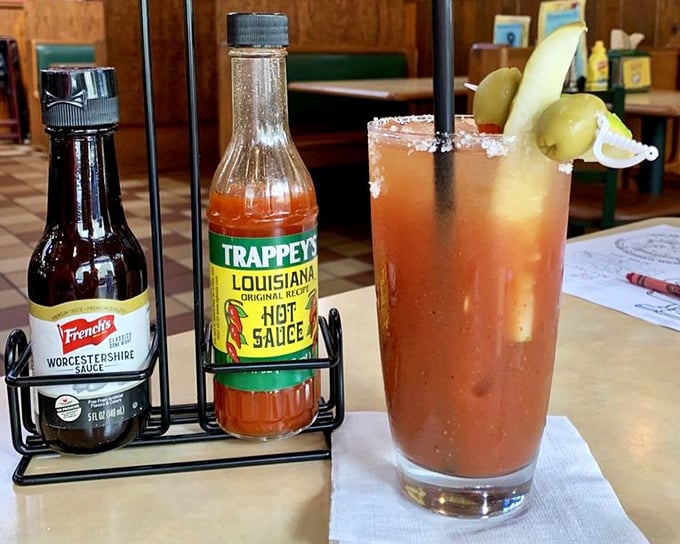 The Bloody Mary arrives with proper garnishes and hot sauce on standby—because some mornings require serious reinforcements.