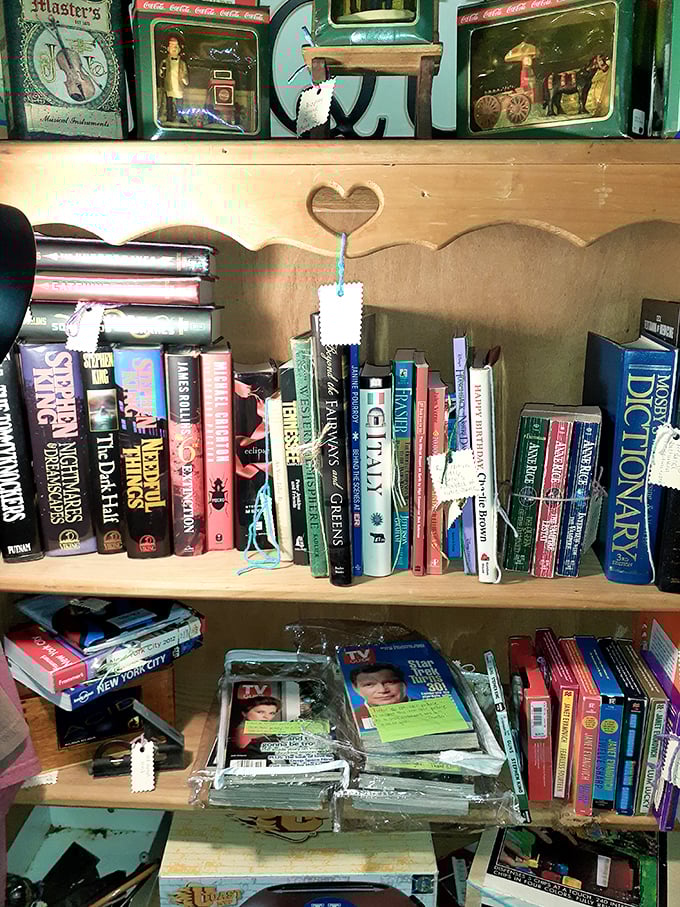 Books stacked with care reveal treasures between their covers. That heart cutout shelf detail is pure country charm.