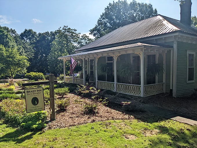 The Brady Inn's wraparound porch practically demands you sit a spell with sweet tea in hand—Southern hospitality with architectural credentials.