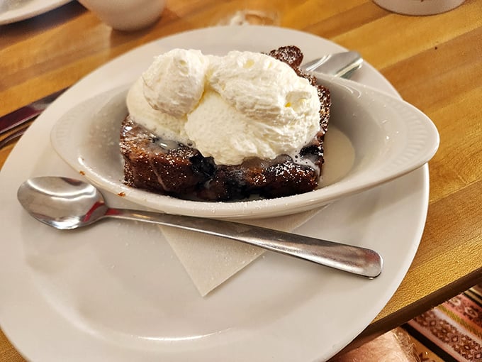 Bread pudding that could end family feuds – warm, rich, and topped with ice cream melting into all those nooks and crannies.