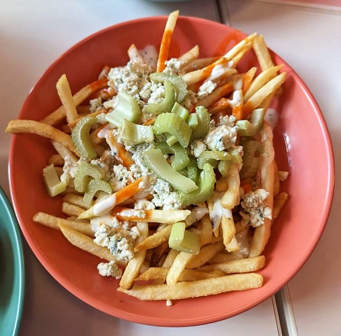 Buffalo-style fries topped with blue cheese and celery – because regular fries weren't already addictive enough on their own.