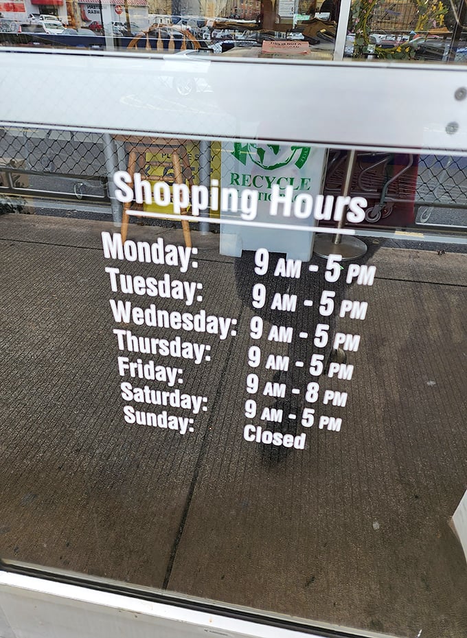 The store hours posted clearly for planning your thrifting adventures—a considerate touch for those who organize their treasure hunting expeditions.
