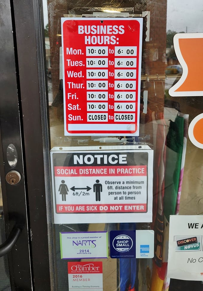 The humble business hours sign: a portal schedule to bargain paradise. Monday through Saturday, 10 to 6—mark your calendars, treasure hunters.