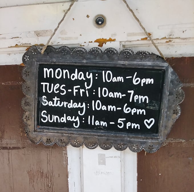Store hours presented with charming imperfection—the little heart at the end suggests they're not just selling stuff, they're sharing love.