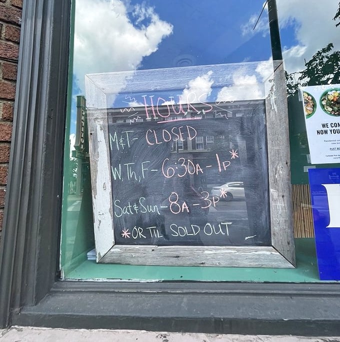 The hours sign with its asterisked "OR TIL SOLD OUT" warning tells you everything about their popularity—arrive early or prepare for disappointment.