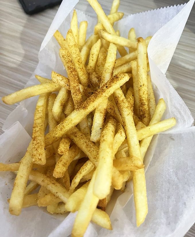These aren't just fries; they're golden wands of potato perfection dusted with Cajun magic – crispy on the outside, fluffy within.
