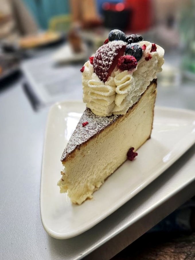 This cheesecake doesn't just end a meal—it creates a memory. Those berries add little bursts of joy to each velvety bite.