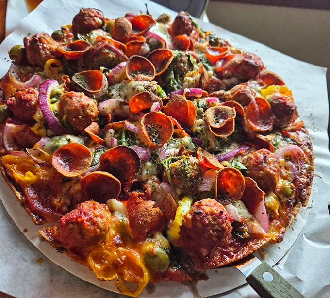 The Chef Surprise isn't just a pizza – it's a colorful canvas of culinary creativity where pepperoni curls like little flavor scrolls among the sausage landscape.