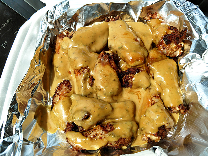 These aren't just chicken wings – they're sauce-lacquered masterpieces. The kind that make you thankful for the invention of wet wipes and completely indifferent to shirt stains.