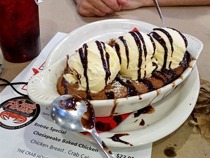 This warm cookie crowned with ice cream and chocolate drizzle isn't just dessert—it's the sweet finale to a seafood symphony. Spoons ready for the standing ovation!