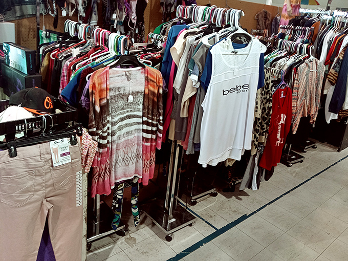 Fashion's circle of life on display—yesterday's mall brands hanging hopefully, waiting for their chance at a second act in someone's closet.