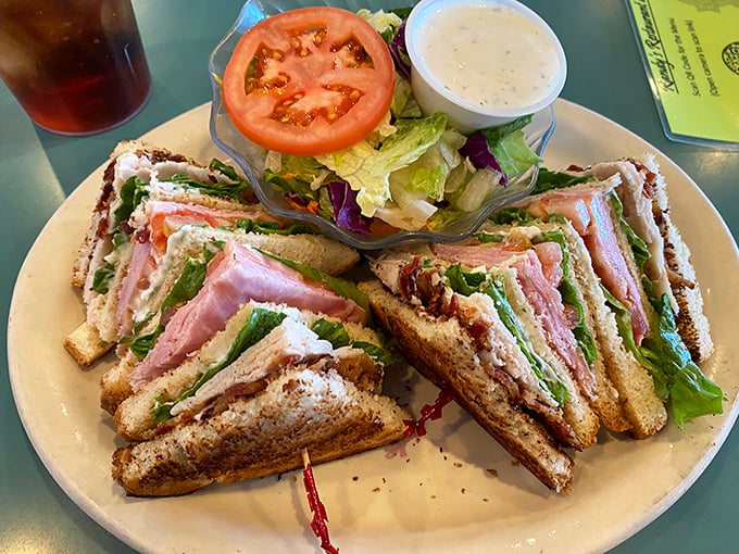 The club sandwich—that three-story architectural marvel that requires jaw unhinging skills but rewards you with the perfect ratio of turkey, bacon, and veggies in every bite.