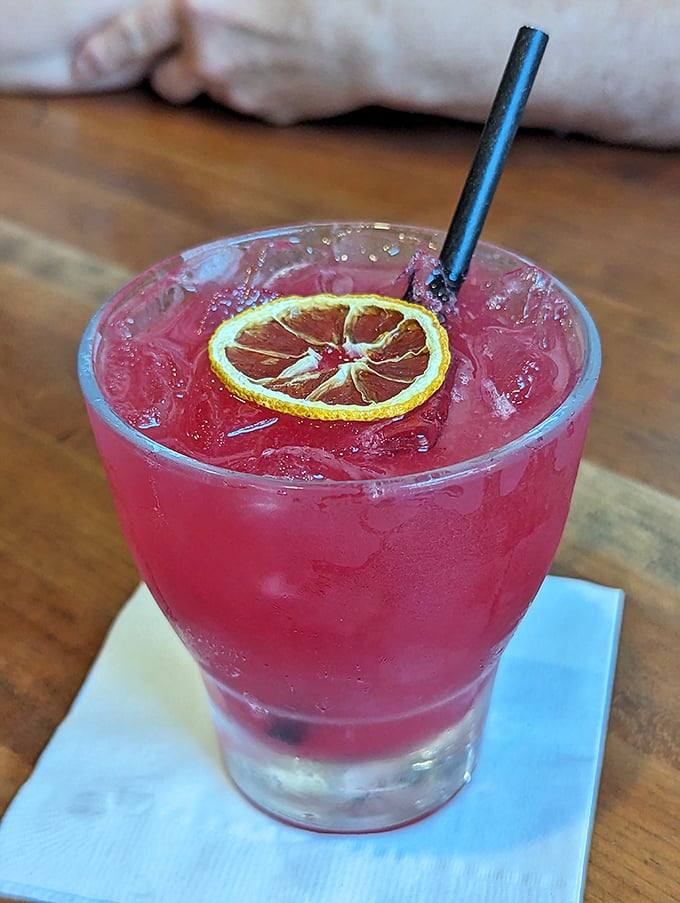 That vibrant cocktail isn't just a drink – it's a vacation in a glass, complete with a lemon slice passport.