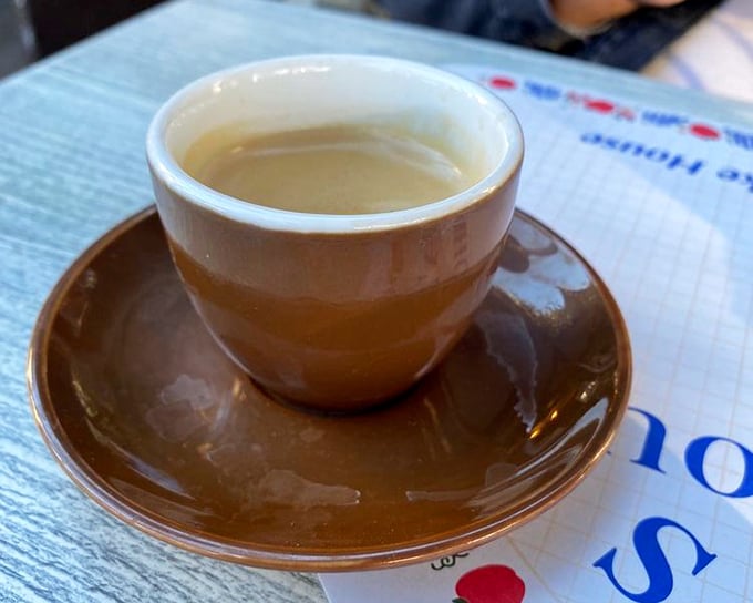 A simple cup of coffee in a brown cup – the unsung hero of every great breakfast experience, ready to bring you back to life one sip at a time.