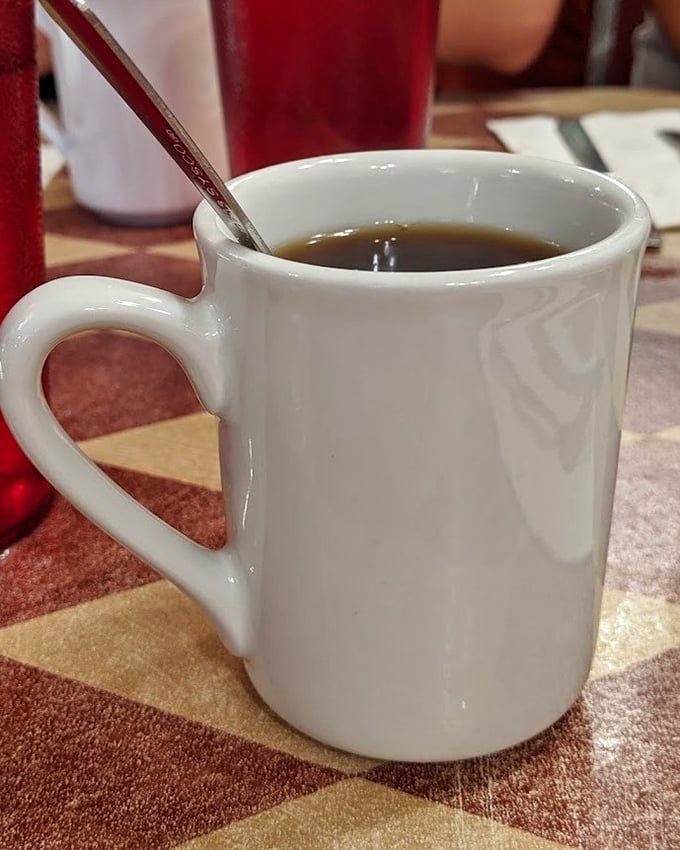 The humble white mug—vessel of liquid motivation and pie's perfect companion. In Wisconsin, coffee refills are practically a constitutional right. 
