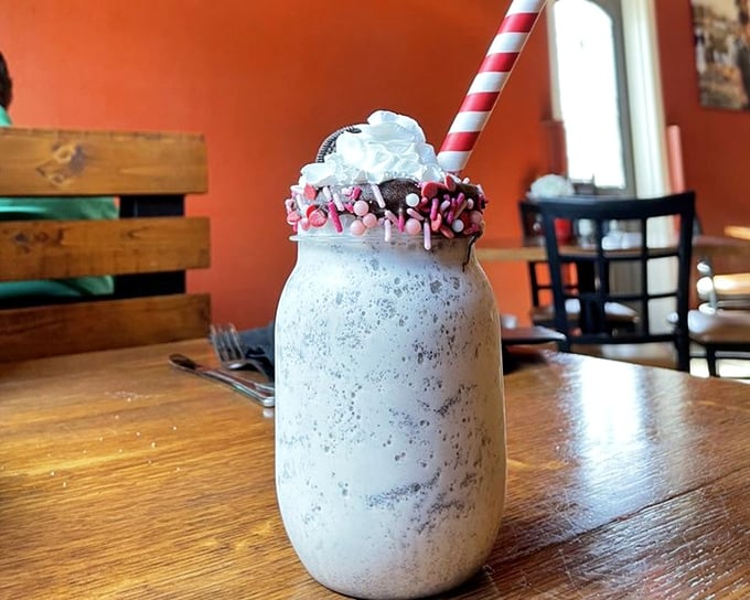 Not just a milkshake, but a dessert skyscraper in a mason jar, complete with whipped cream penthouse and sprinkle rooftop garden.
