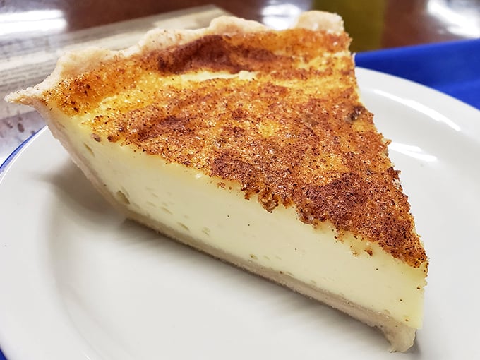 Custard pie with a perfectly caramelized top that cracks satisfyingly under your fork—simple, unpretentious, and absolutely unforgettable.