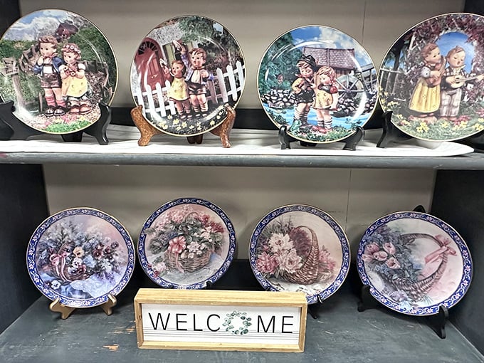 Decorative plates that time forgot—each one a portal to someone's idea of pastoral perfection, complete with rosy-cheeked children.