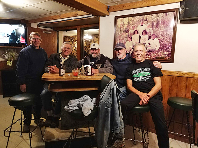 The regulars' table, where friendships are seasoned like fine steaks and stories improve with each retelling—just like the old fashioneds.