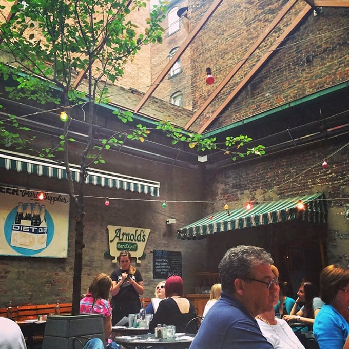 The courtyard dining area feels like Cincinnati's best-kept secret—until you realize everyone else has discovered it too. String lights and brick walls create magic.