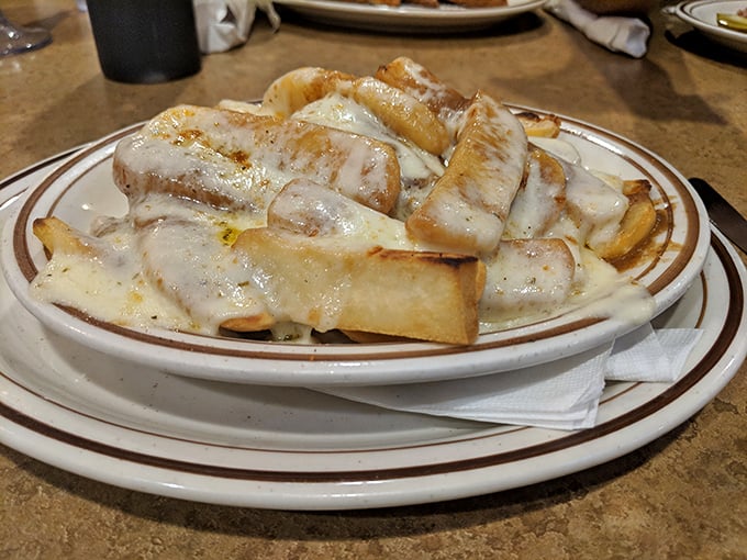 Disco fries—the glorious marriage of crispy potatoes, melted cheese, and gravy that makes you wonder why you'd eat fries any other way.