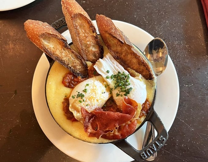 These eggs Basquaise aren't just breakfast—they're a sunny revelation. The crispy bread soldiers standing at attention are ready for their delicious duty.