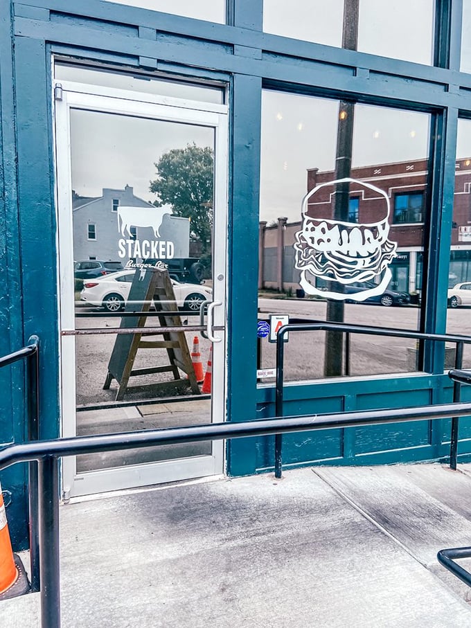 Even the entrance makes a statement—clean lines, bold branding, and a burger silhouette that beckons you inside.